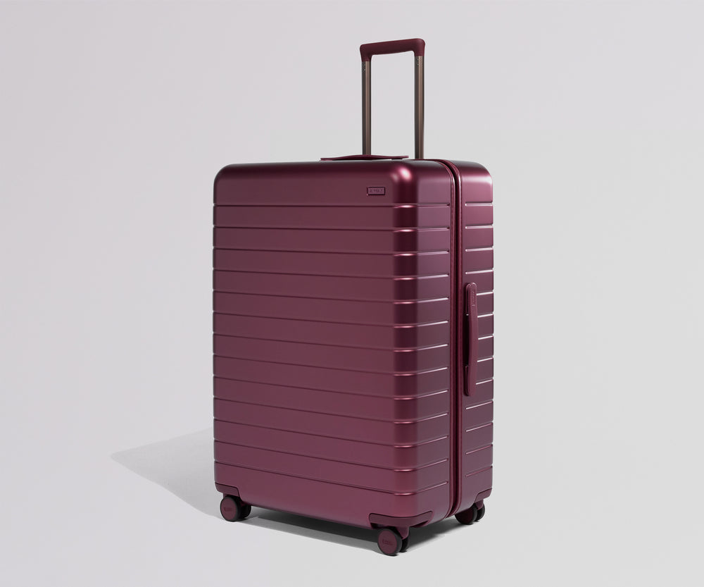 Shop Large & Checked Suitcases in Ruby Haze | Away