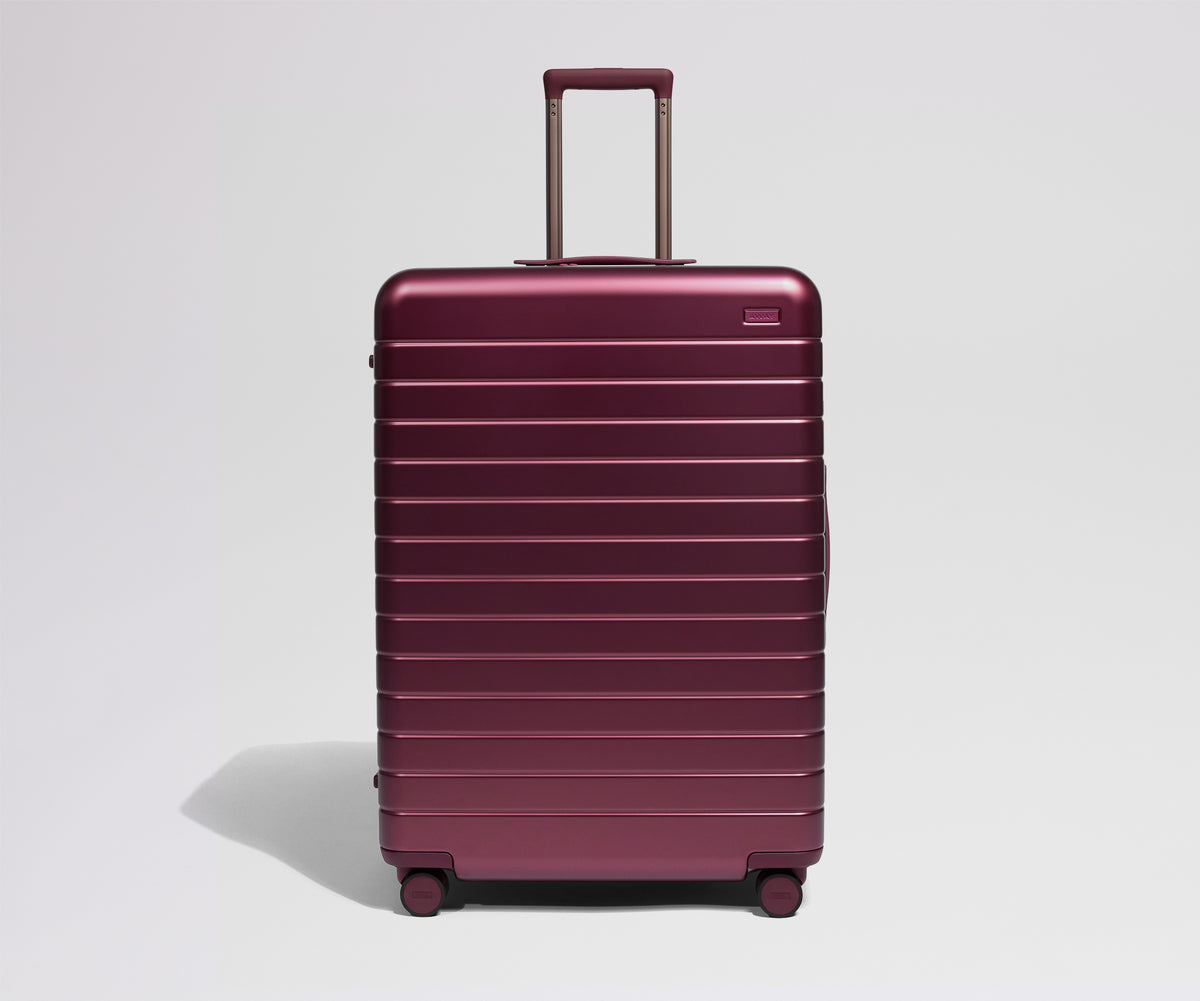 Shop Large & Checked Suitcases in Ruby Haze | Away
