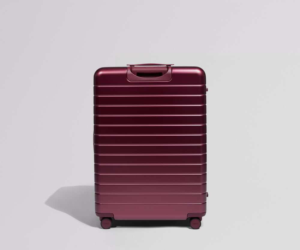 Shop Large & Checked Suitcases in Ruby Haze | Away