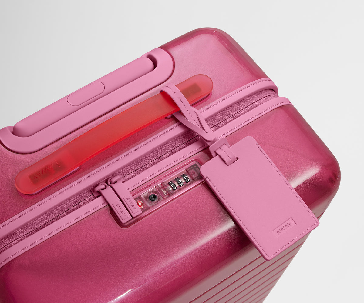 Shop The Bigger Carry-On suitcase in Translucent Pink | Away